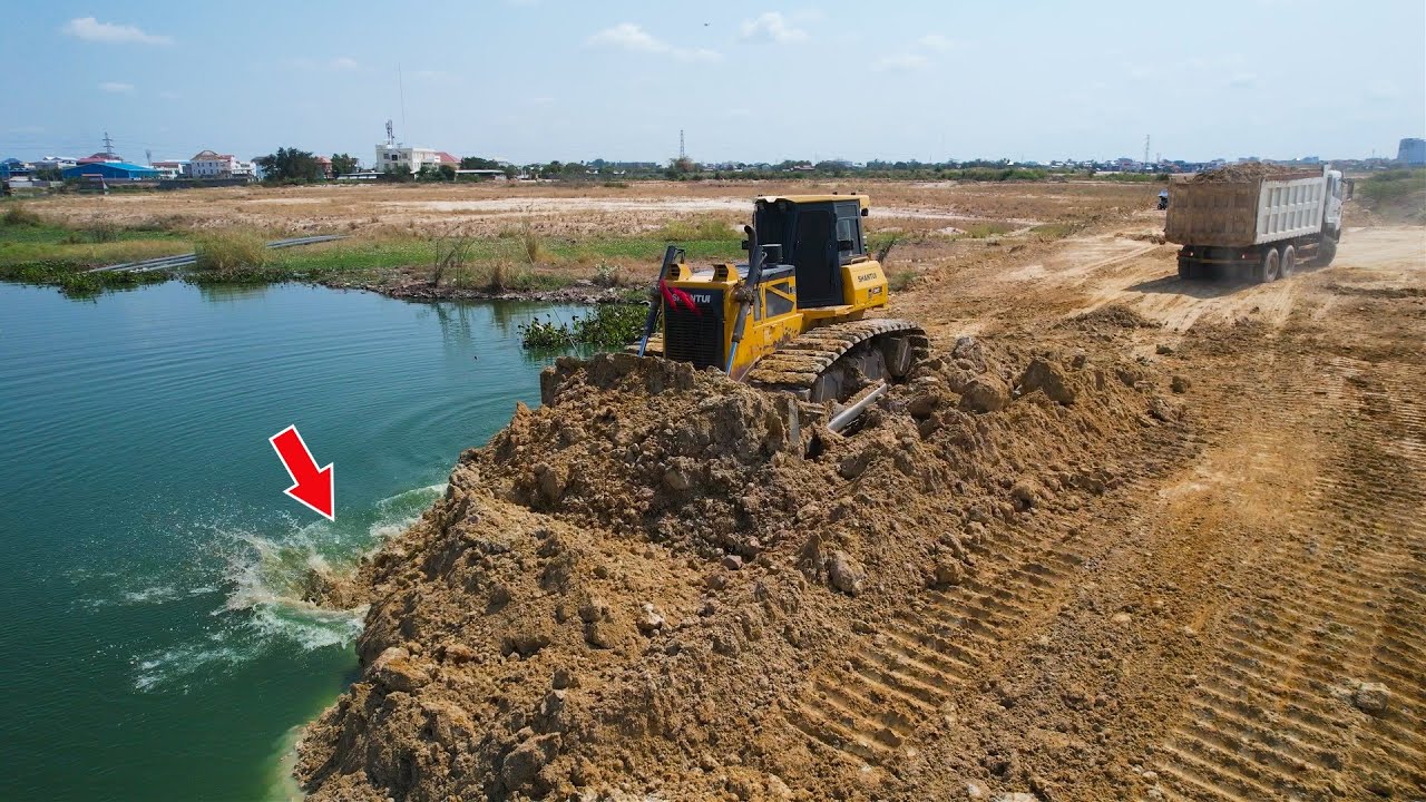 Most Power Road Building Machines Across The Water Dozer Pushing Dirt ...