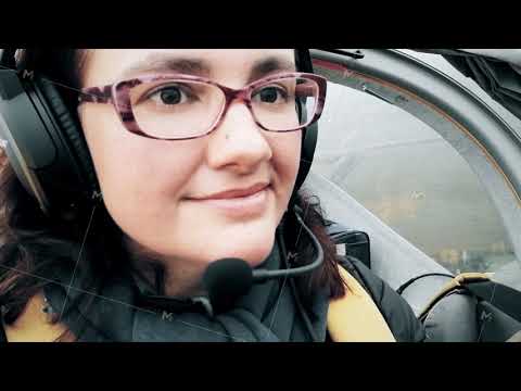 woman pilot flying plane, close up portrait, cute young happy smiling, hobby freedom concept sky
