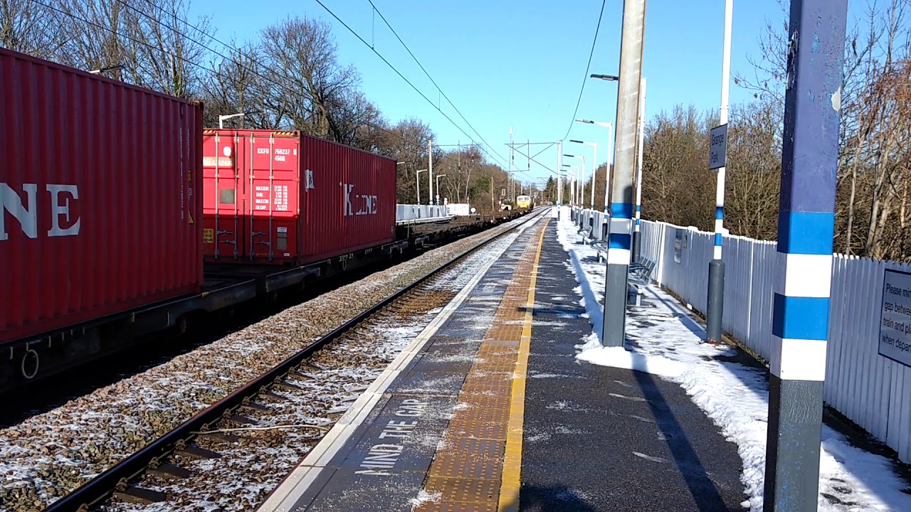 Freightliner Class 66554 at Grange Park 25/1/21 on a sunny, snowy day ...