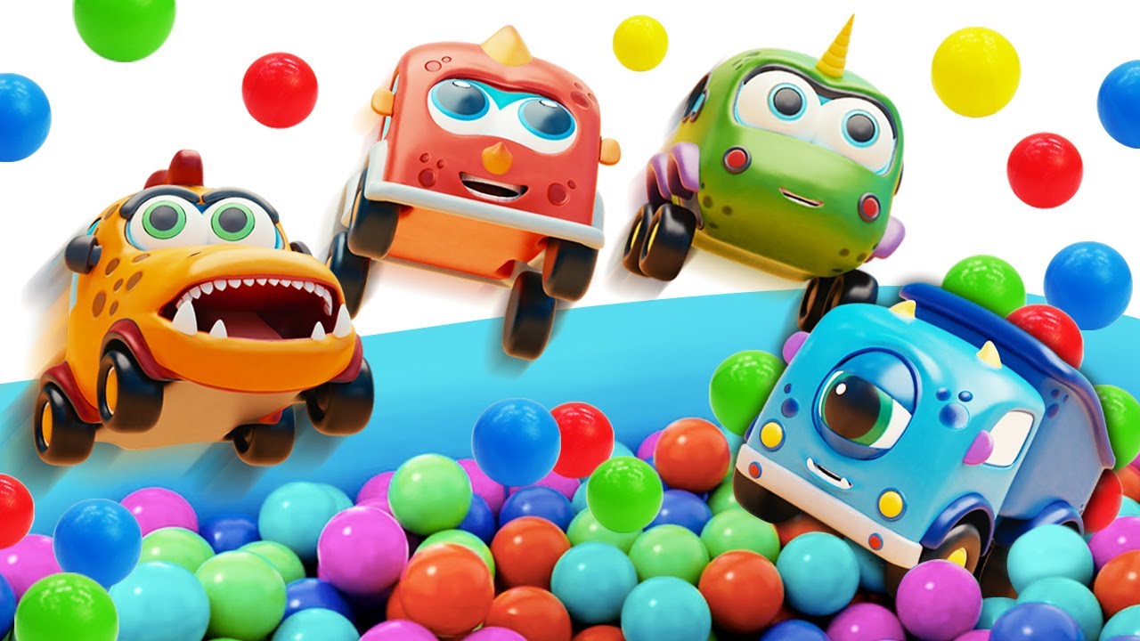 The little monster cars are having fun and jumping into an inflatable ...