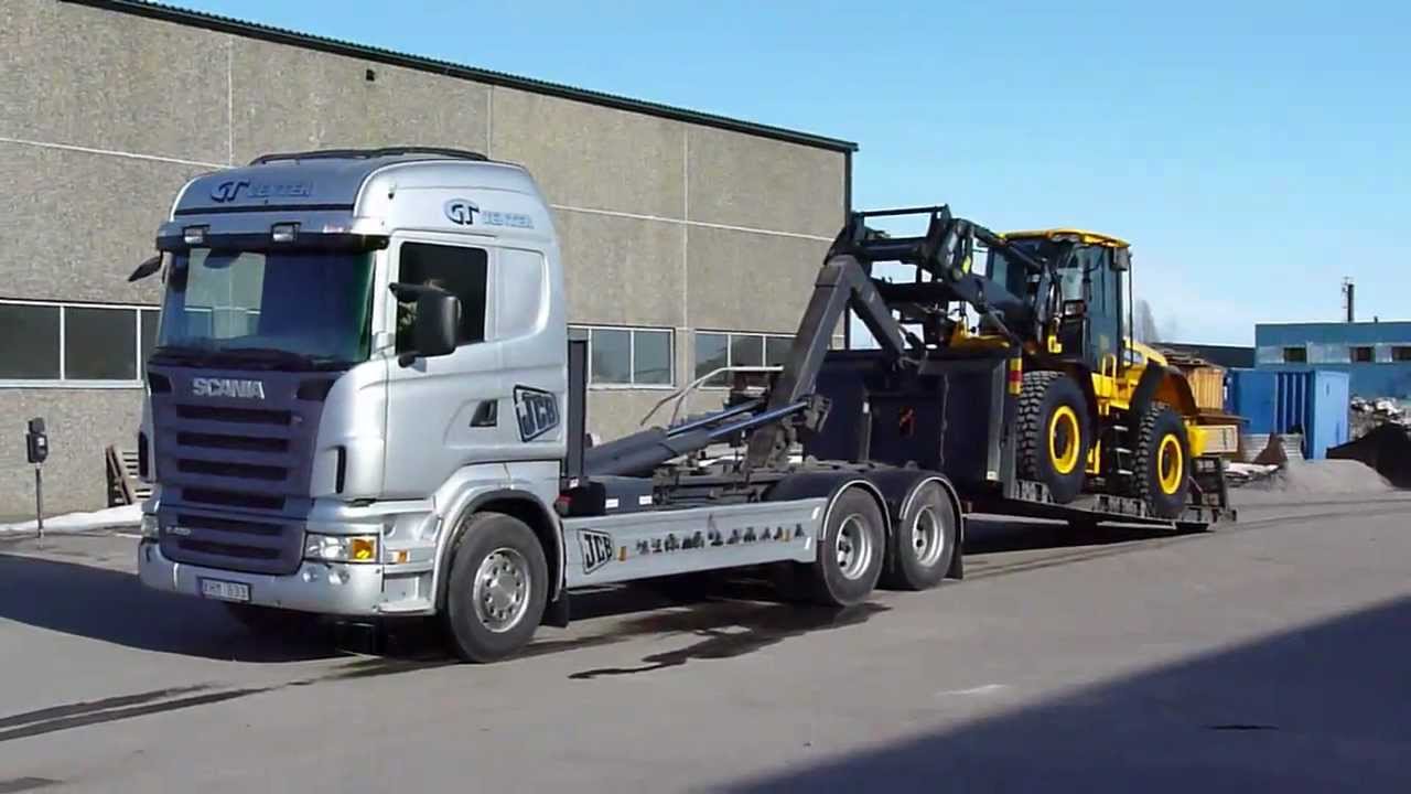 Scania R420 Hook lifter unloading a new JCB426E Weelloader - YouTube