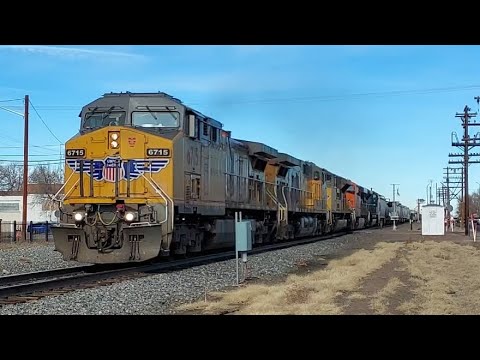 EX CNW UP locomotive leads a manifest with MRL 4317 trailing 5th out (UP BNSF and MRL lash up ...