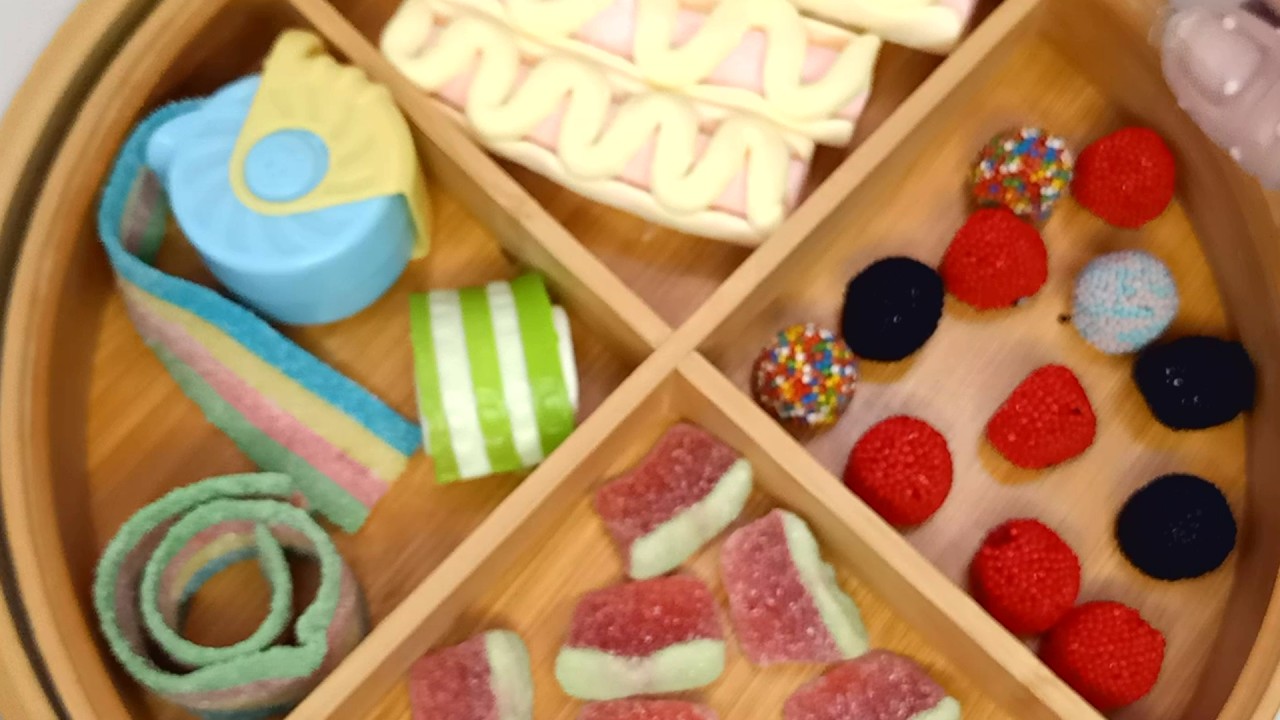 ASMR. Filling platter alluring sweets. Non-standard packaging of sweets ...