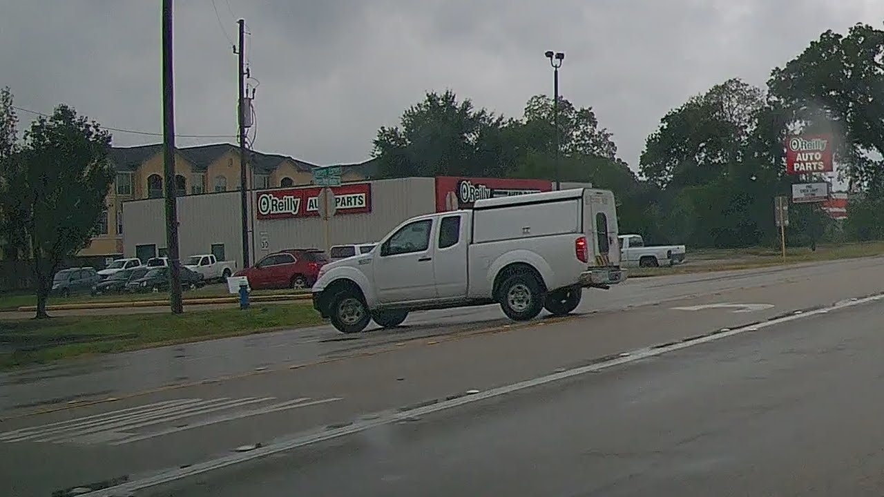 White Truck Fishtails on Wet Road While Making Right Turn - YouTube