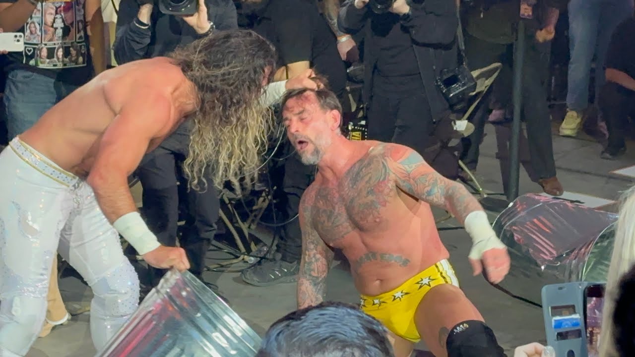 Seth Rollins smashes CM Punk with trash can at Mania! #wwe # ...