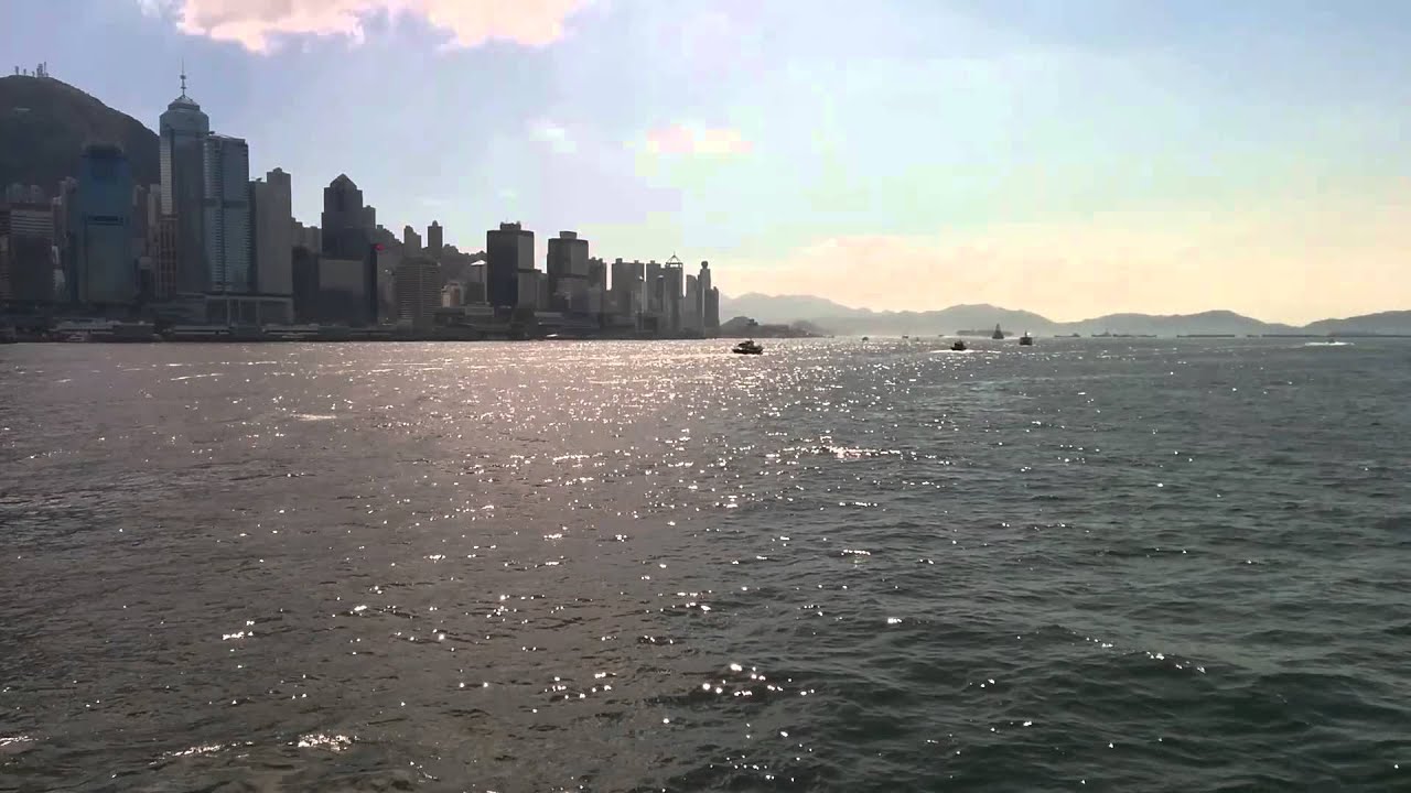 RAW VIDEO: Star Ferry pier harbour view, sunny day, partly cloudy in ...