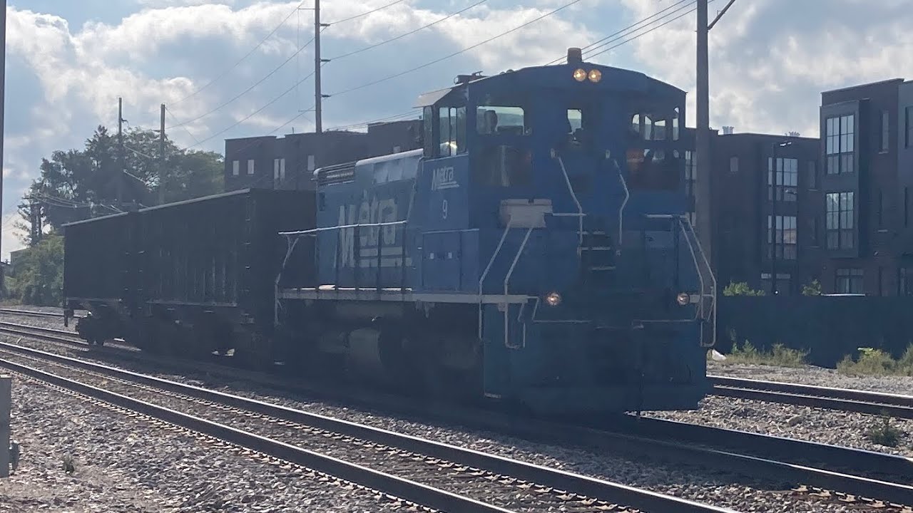 Metra 9 SW1500 leading a small ballast train at River Grove Illinois ...