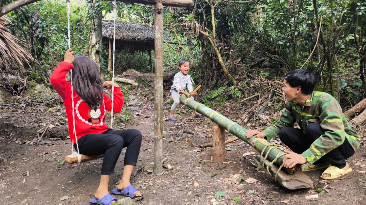 The woman saw the man making a swing and a rocking bridge for the child ...