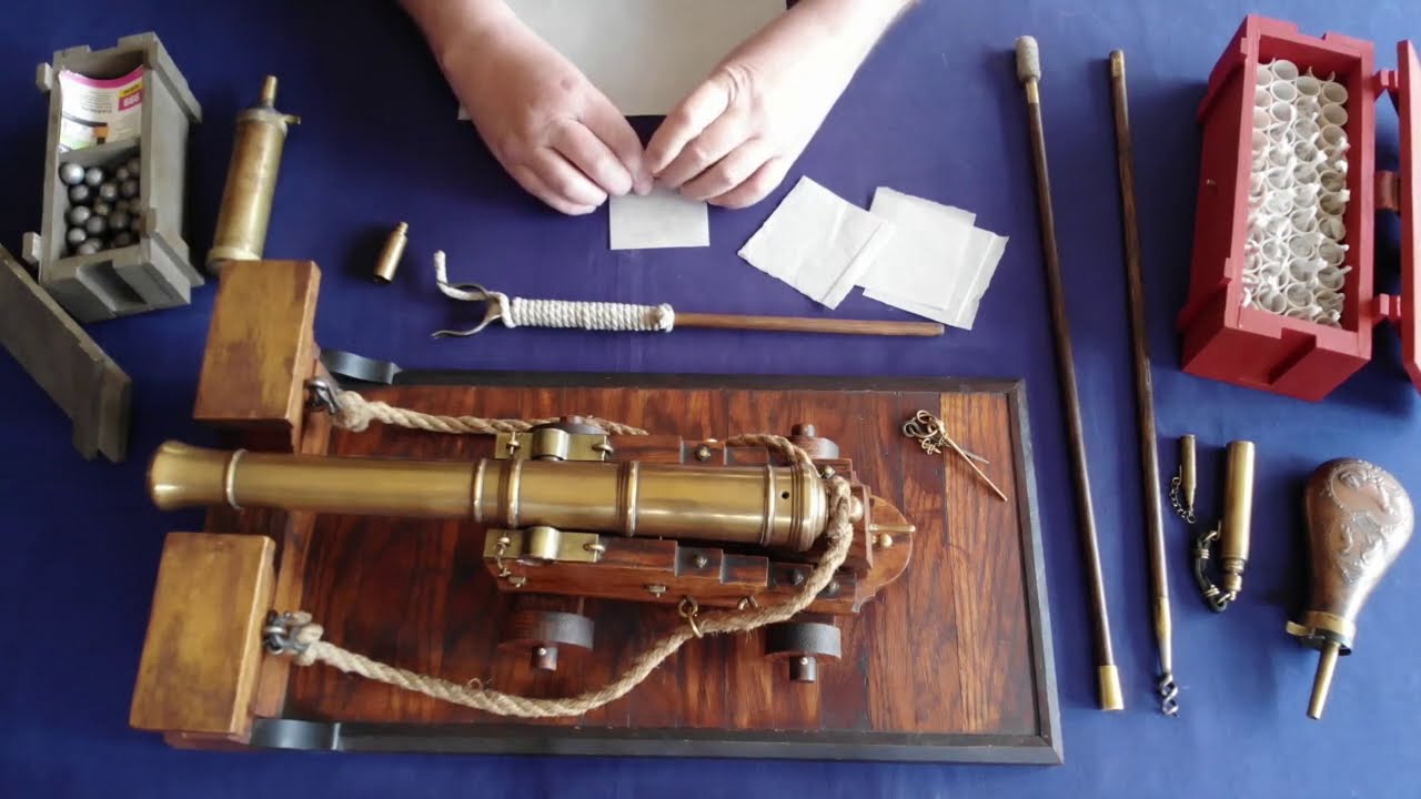 Cartridge and loading demonstration for a muzzle loading cannon. - YouTube