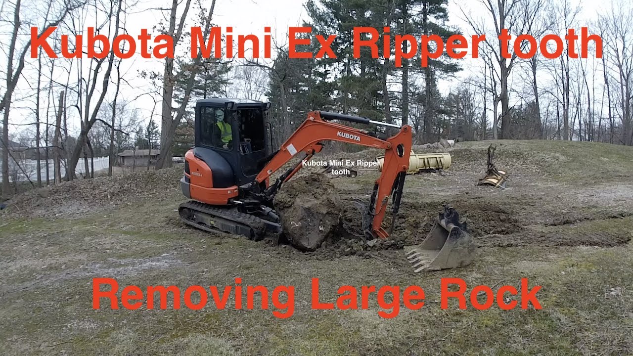 Kubota KX-033 Mini Excavator removing huge rock buried with new ripper ...