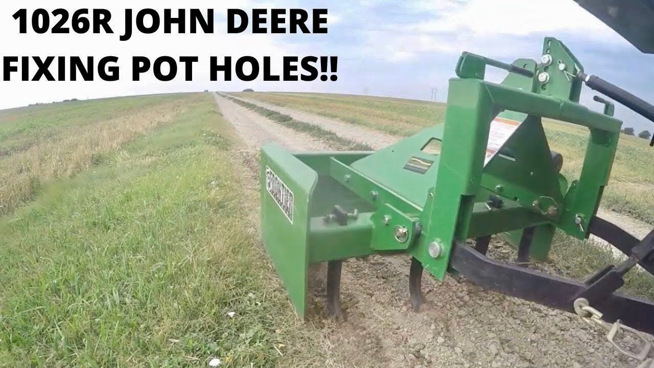 John Deere 1025R Fixing the Pot Holes w/ Box Blade - YouTube
