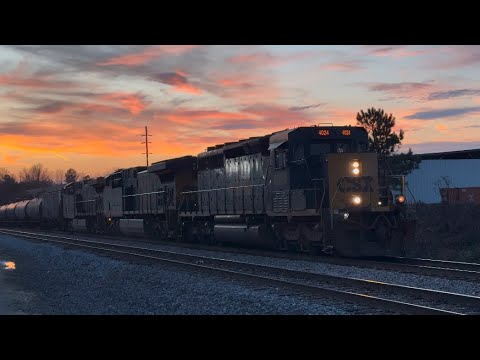 CSX #4024 SD40 highballs past lawrenceville airport with a long string ...