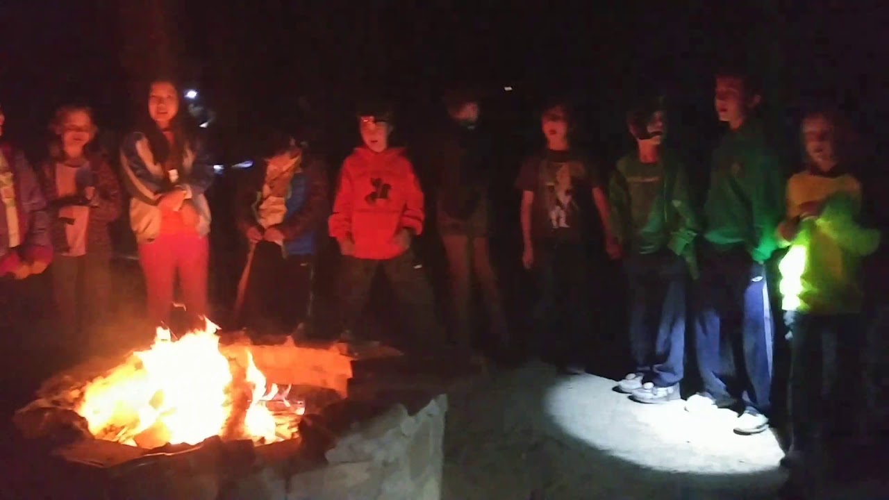 Singing around the campfire. - YouTube