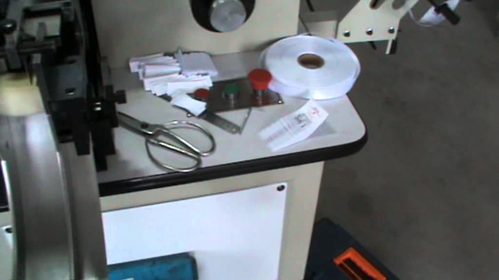 label fabric cutting and folding - YouTube