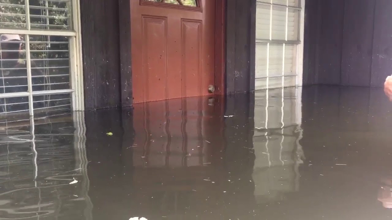 Sammy Strong enters his home after the flood. - YouTube