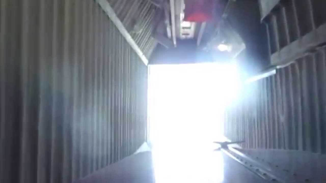 Truck drive-through in to silo - YouTube