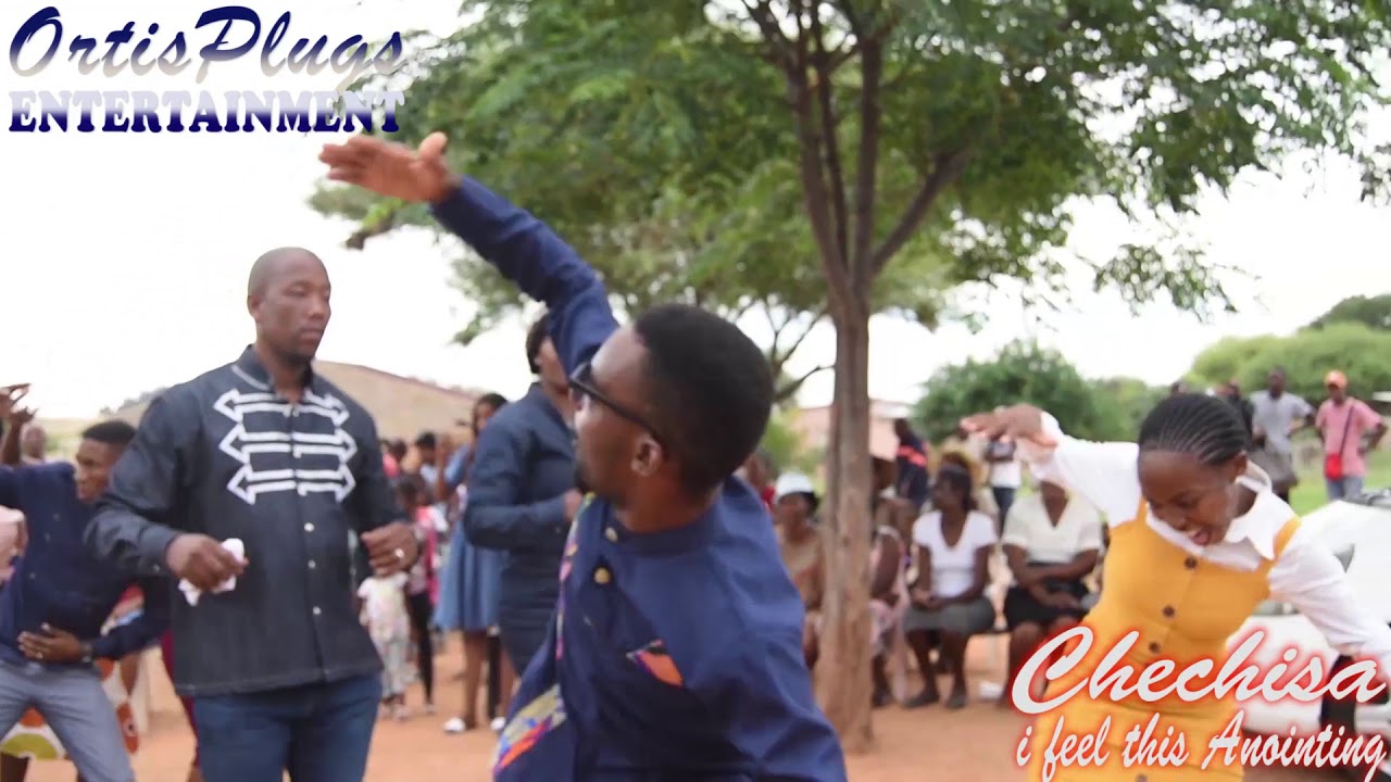 Apostle Chechisa wth his wife & their congregation dance in a wedding ...