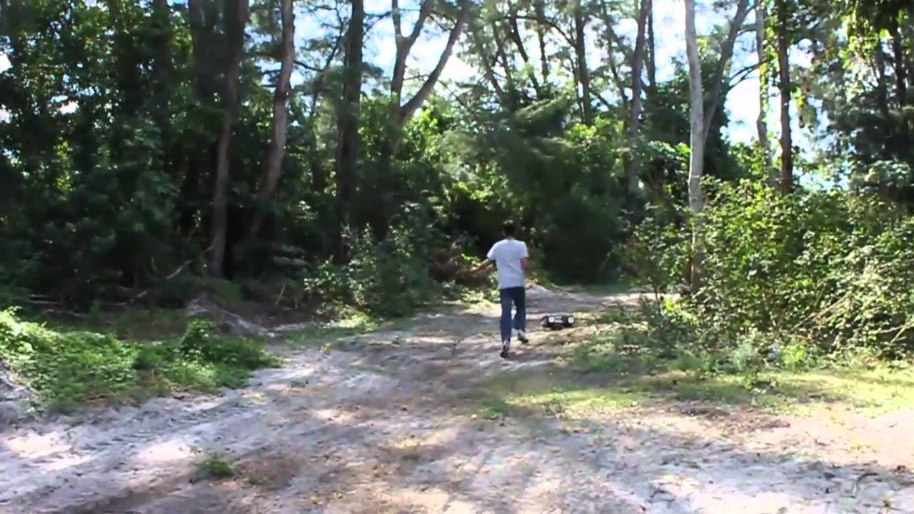 Brushless Emaxx E Maxx E-maxx Bashing 50 foot jump - YouTube