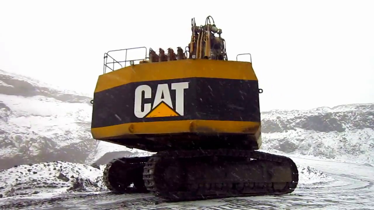 Caterpillar 5130 Loading Blasted Rock - YouTube