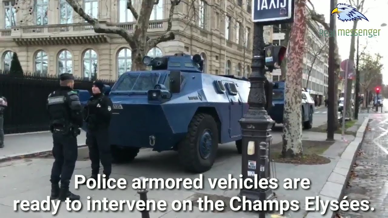 French :Police armored vehicles are ready to intervene on the Champs ...
