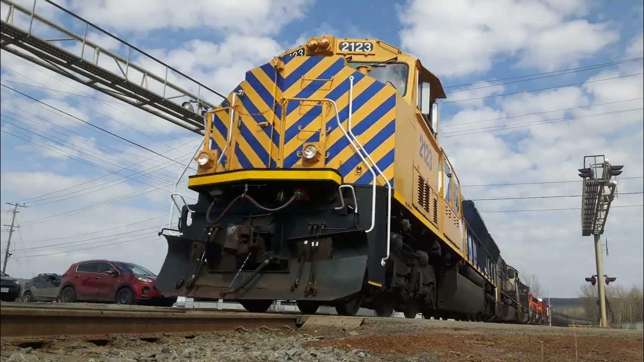 Big surprise, ONR 214 arriving at highway crossing with units ONR 2123,2122,2124, BNSF 1563 ...