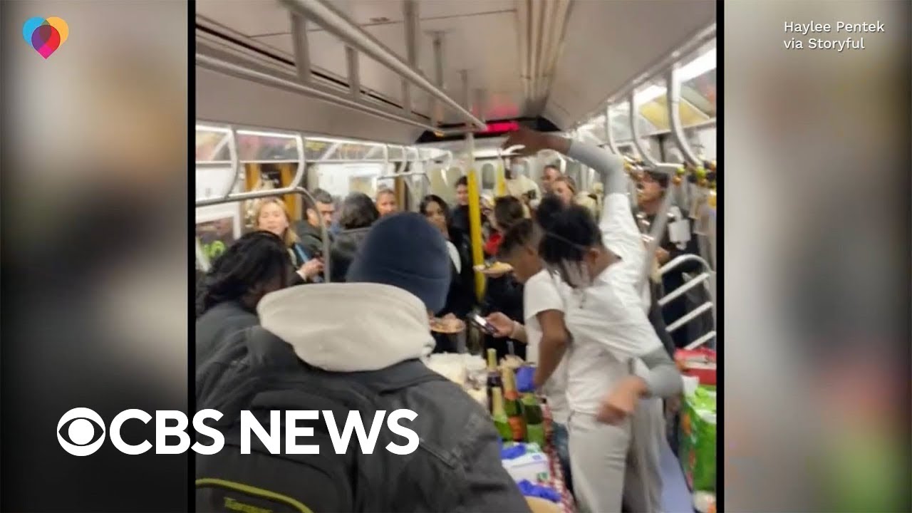 NYC subway passengers serve full Thanksgiving meal during commute - YouTube