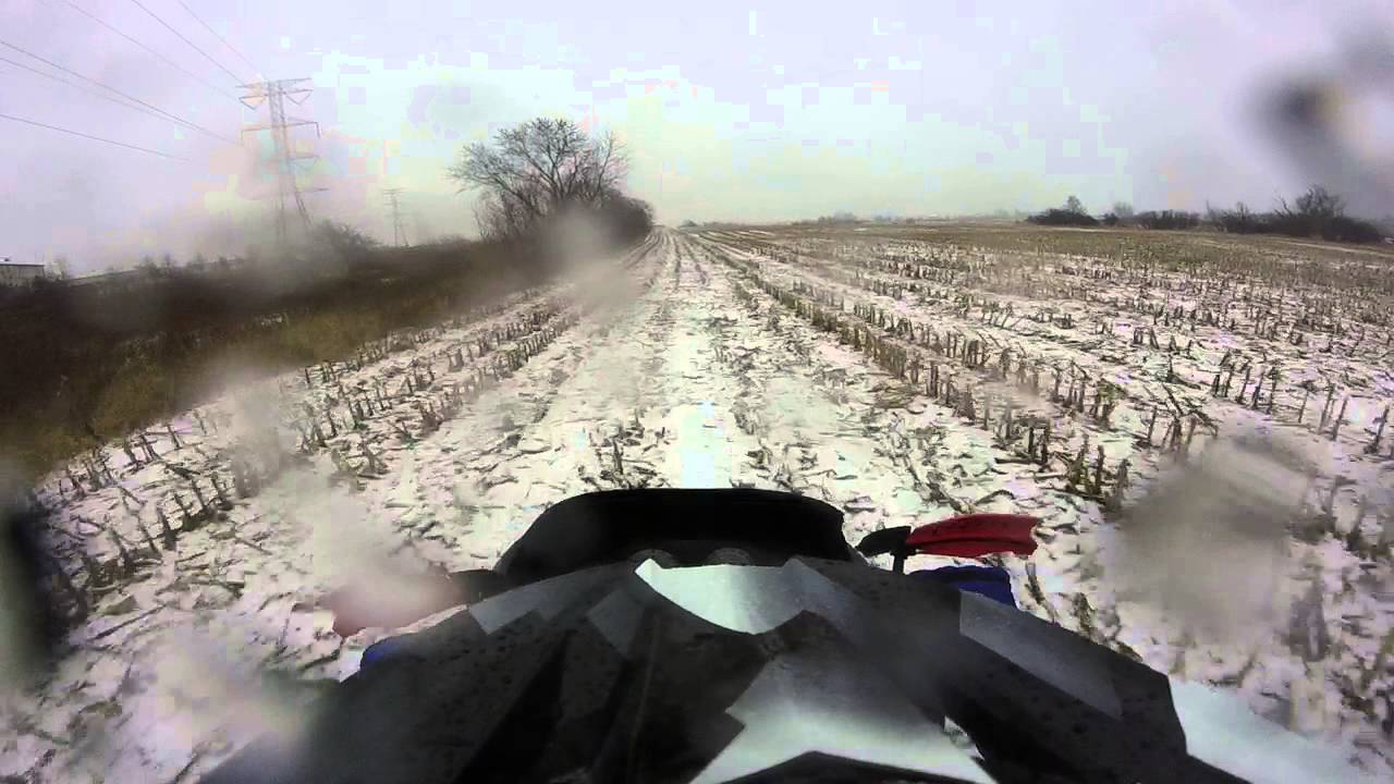 Illinois snowmobile in corn field - YouTube