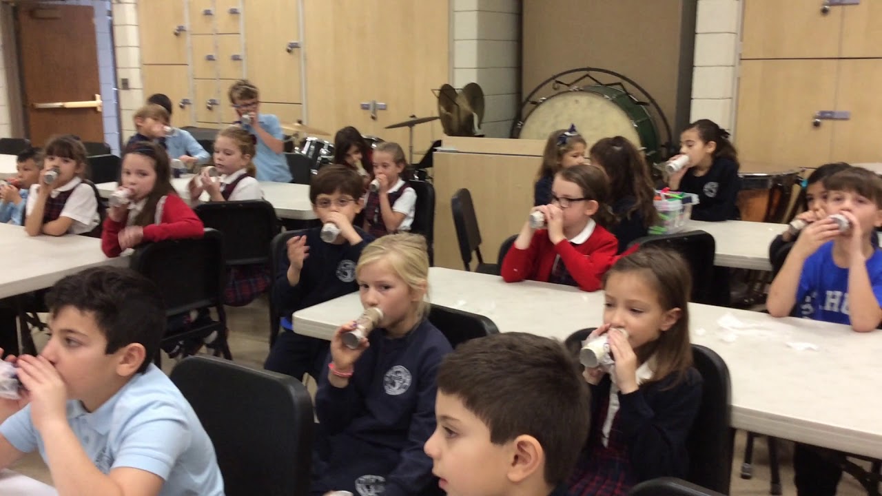 Second graders playing handmade Kazoos - YouTube