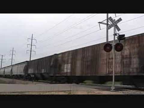 IC 1000 Flying Over Railroad Crossing W/ CN Freight Train - YouTube