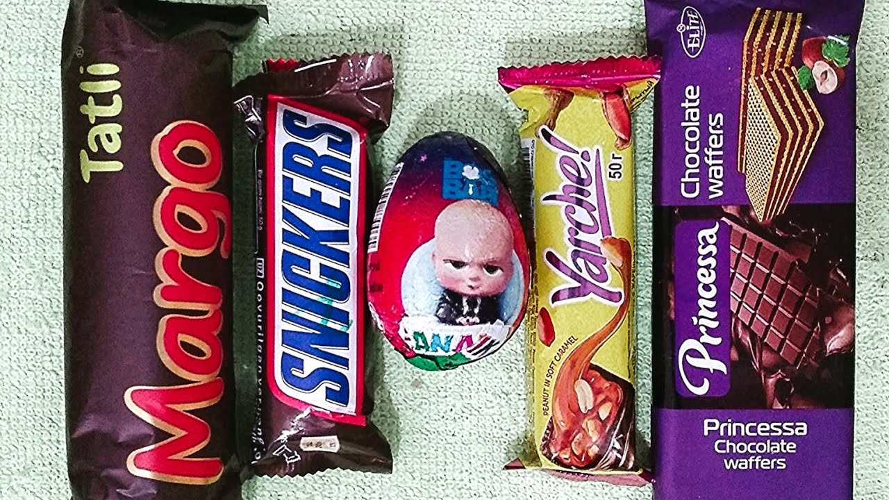 Pala Pala tore the paper of the chocolate and showed the chocolate and ...