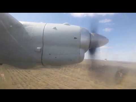 Antonov An-24 Yuzhnoe Nebo landing on unpaved runway at Semey Airport