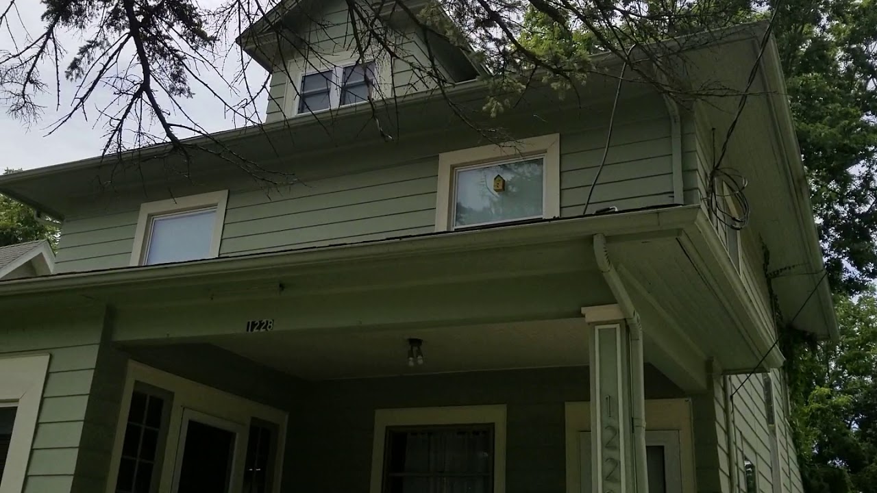 Using a gutter snake, to clean out a gutter downspout. - YouTube