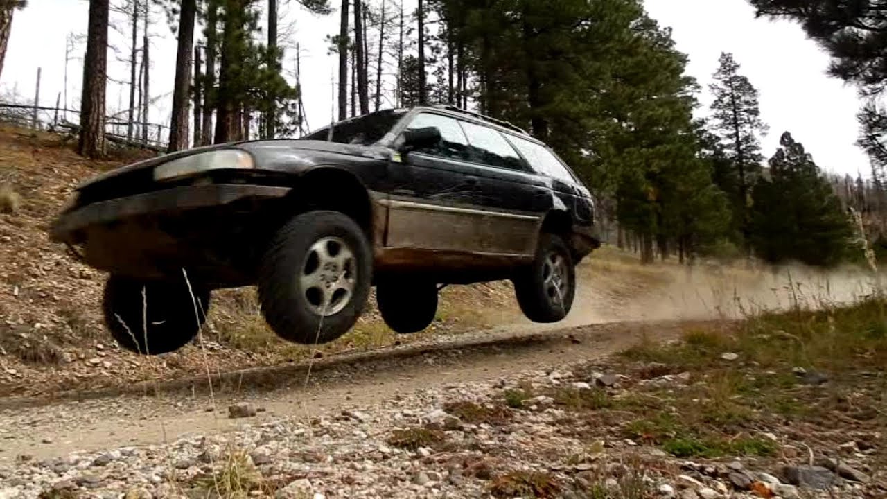Subaru Outback and Forester with long travel struts jumping in New ...