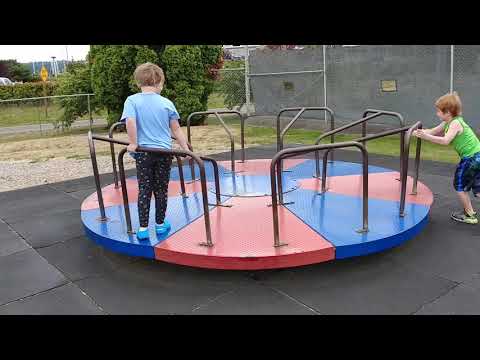 Kids on old school merry go round - YouTube