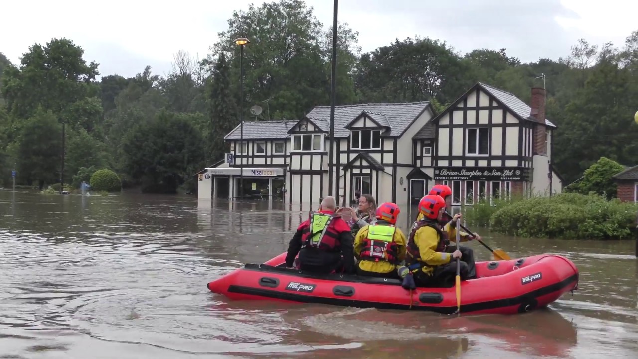 Flood Water at Bramhall Roundabout Maroons People in Businesses and in ...