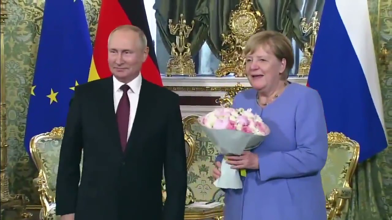 Russian President Vladimir Putin brought flowers for German Chancellor ...