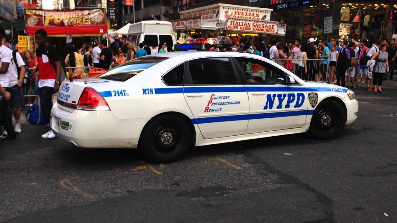 NYPD POLICE CRUISER RESPONDING ON 7TH AVENUE IN THE TIMES SQUARE AREA ...