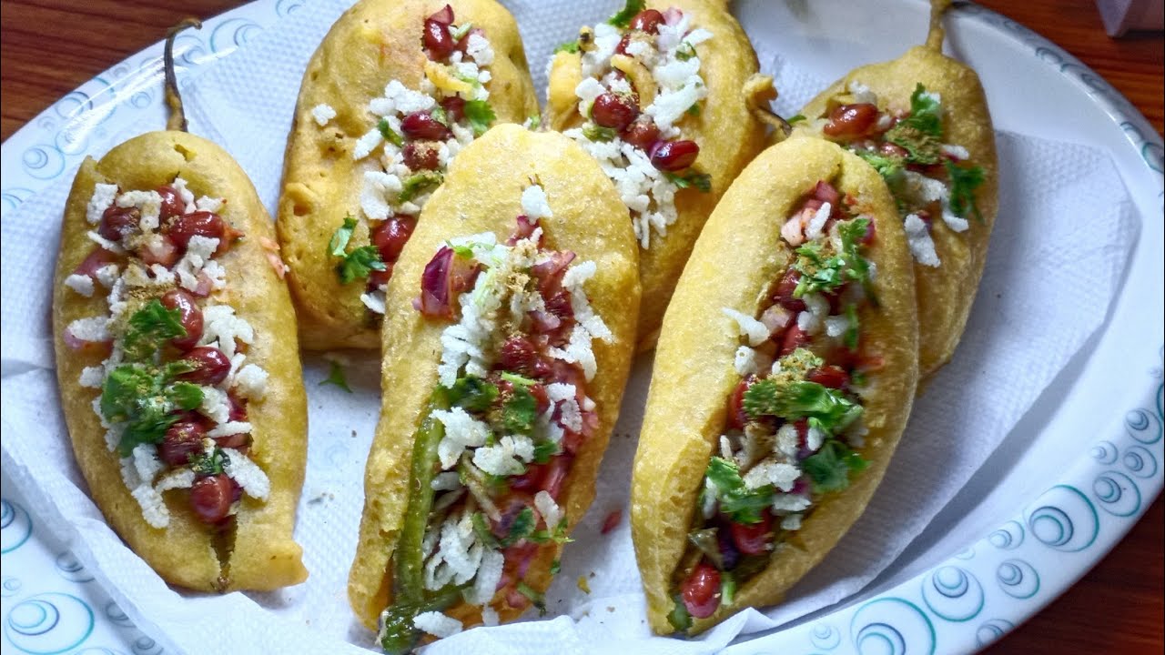 Hyderabadi street food Mirchi Bajji (peanut rice flakes onion stuffed ...