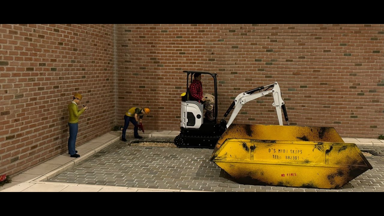 Bobcat E20 Digging Up A Cobbled Road 1/14 - YouTube