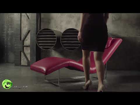 Seductive vamp woman relaxing in lounge chair