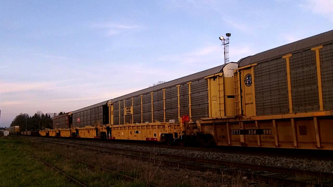 CP 235 w/ CP 9503 (new paint job) & CP 9350 lead this long WB Intermodal/baretable/Autorack ...