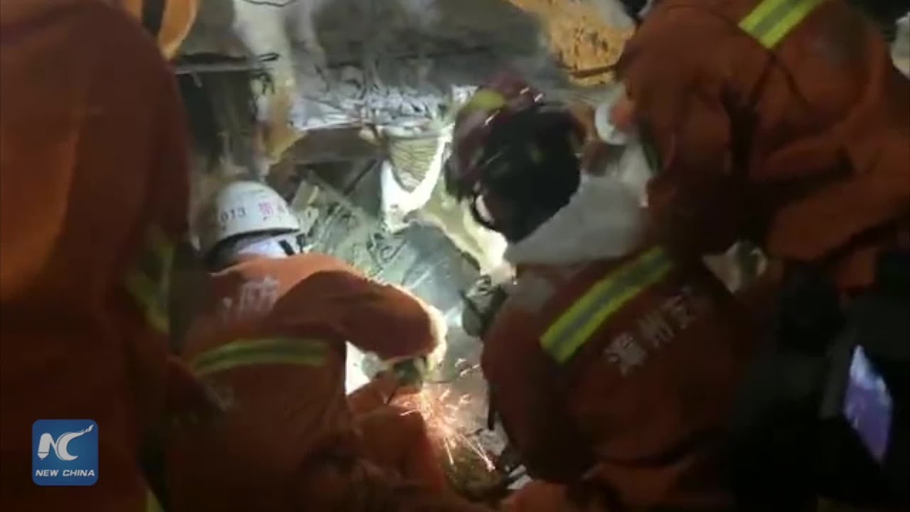Mother and child rescued from a collapsed hotel after being trapped for ...