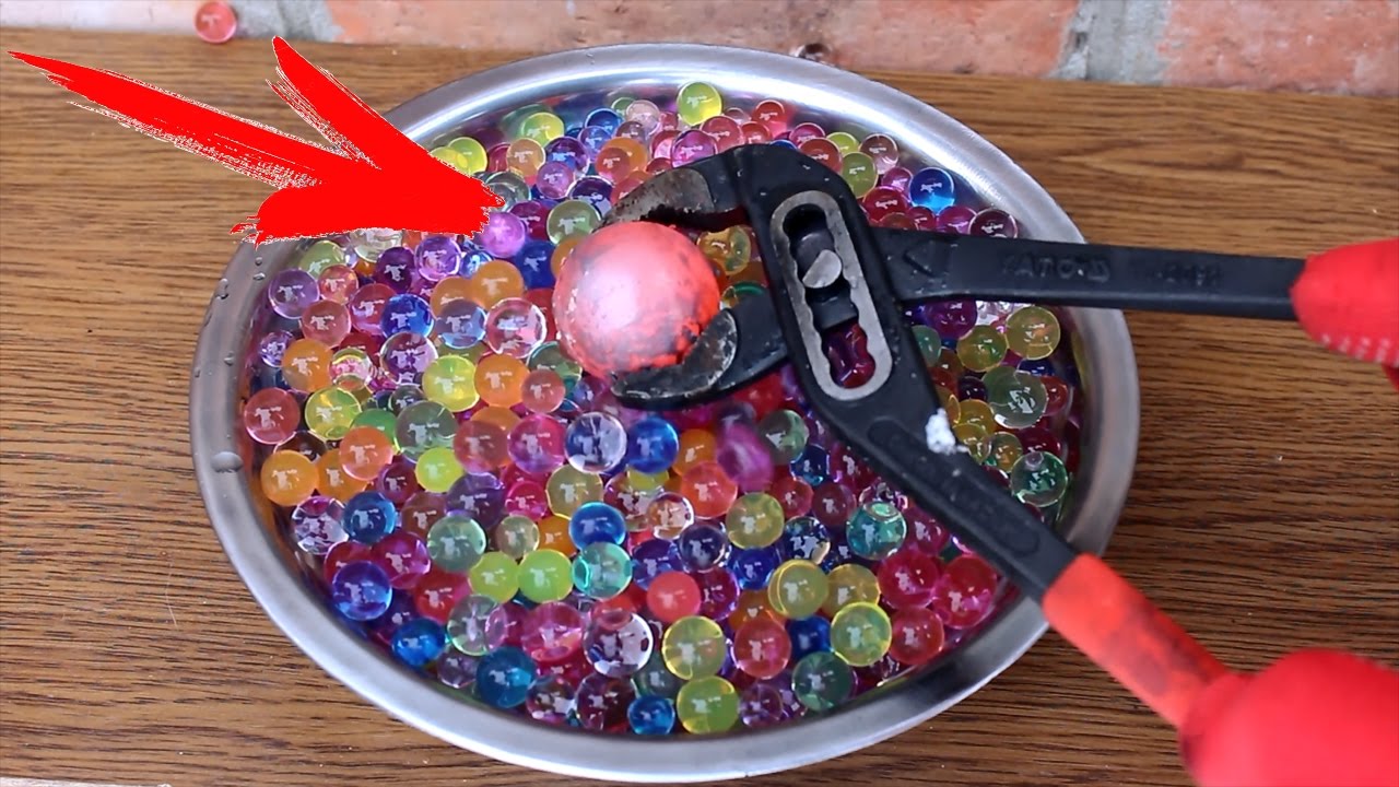 EXPERIMENT Glowing 700 degree metal ball VS BALLS ORBIZ - YouTube