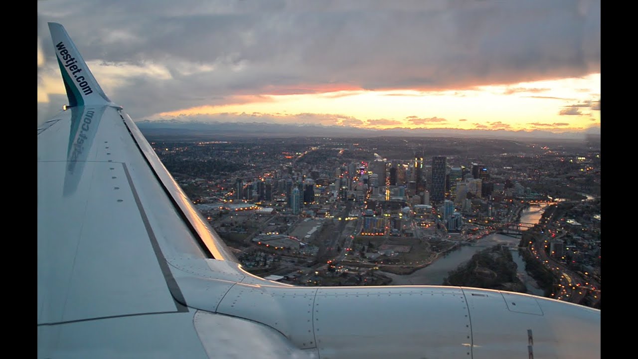 WestJet Boeing 737-700 Onboard Sunset Landing - YouTube