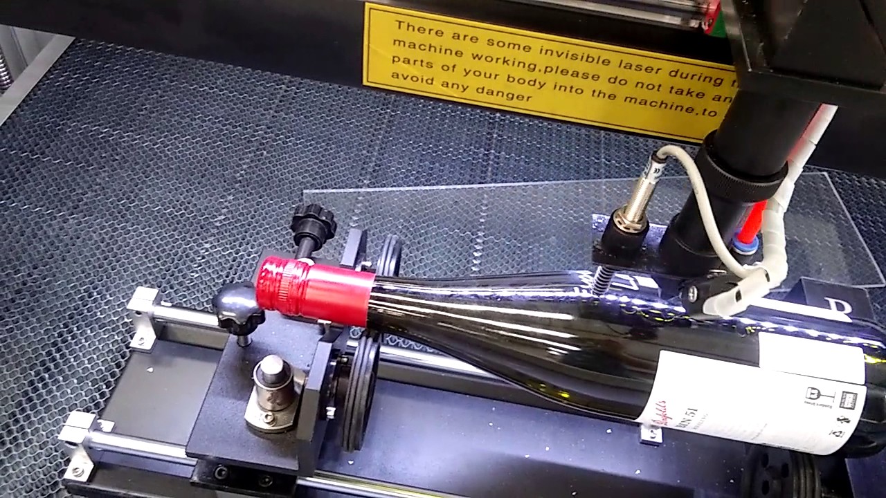 Video of laser machine engraving wine bottle from Nice Cut Ivy - YouTube
