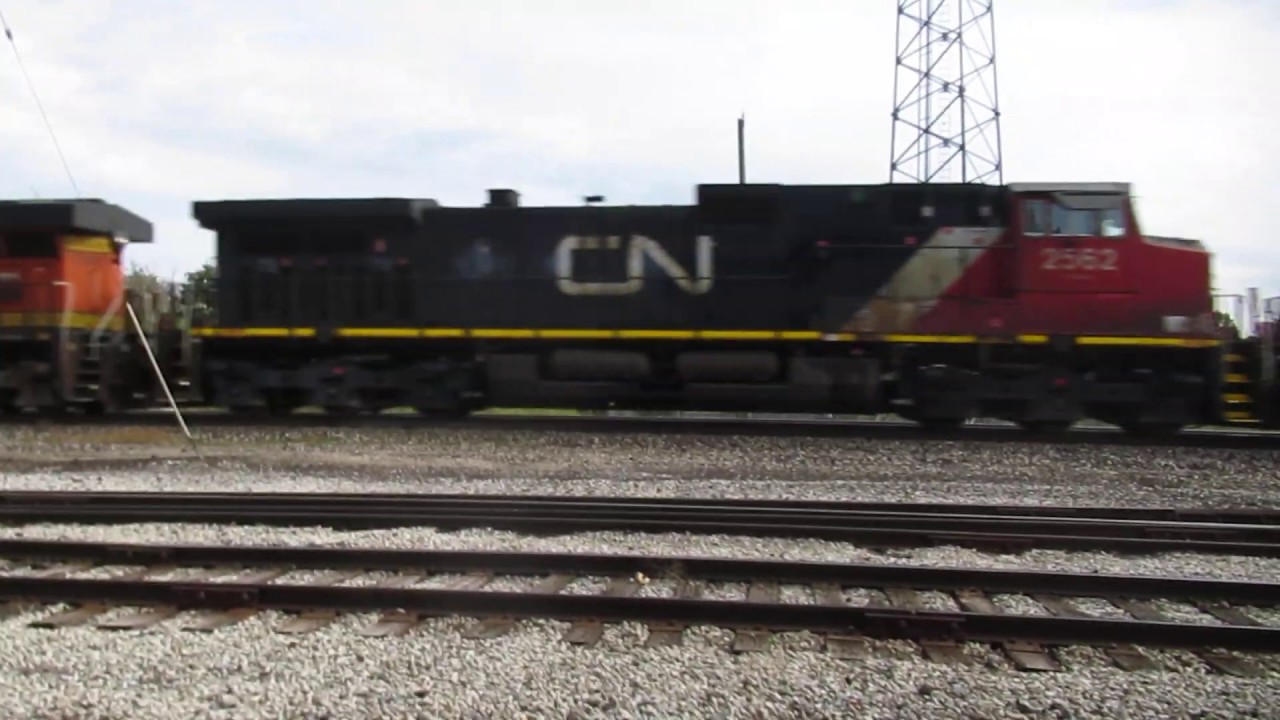 CREX 1508, CN 2562, BNSF 7202 speeding with a Westbound freight train ...