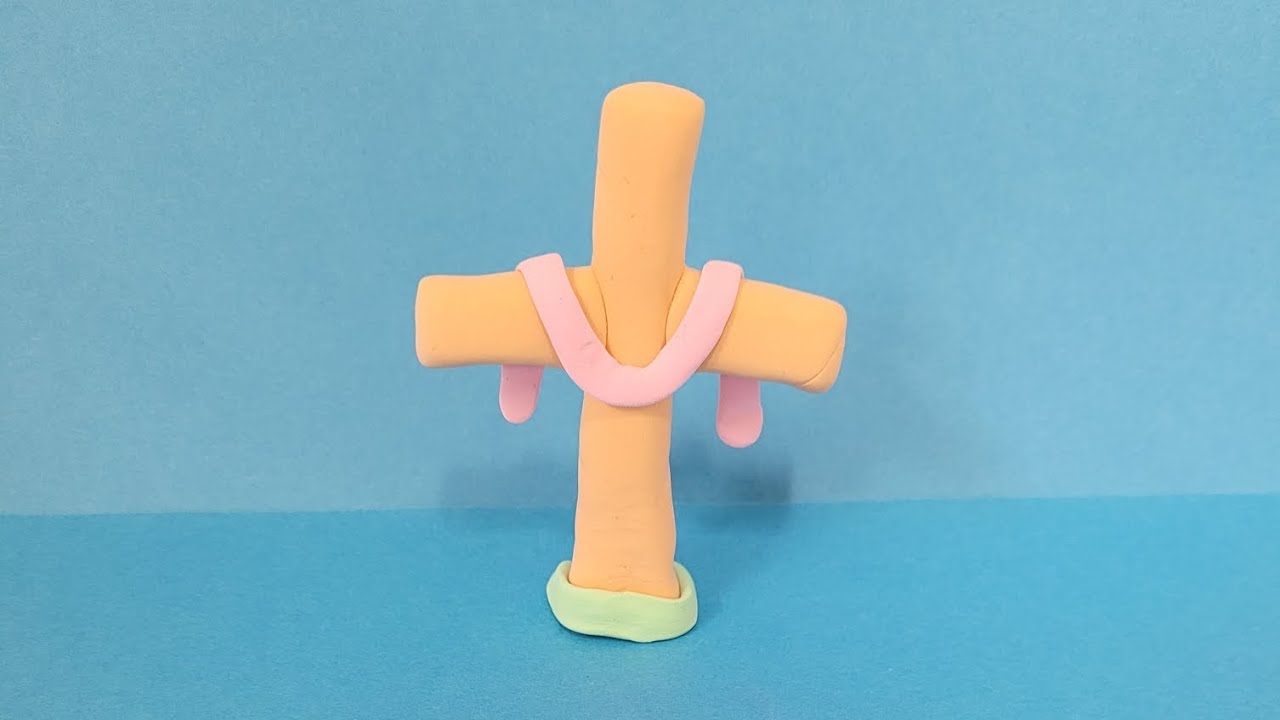 How to make a cross out of model magic clay and markers ...