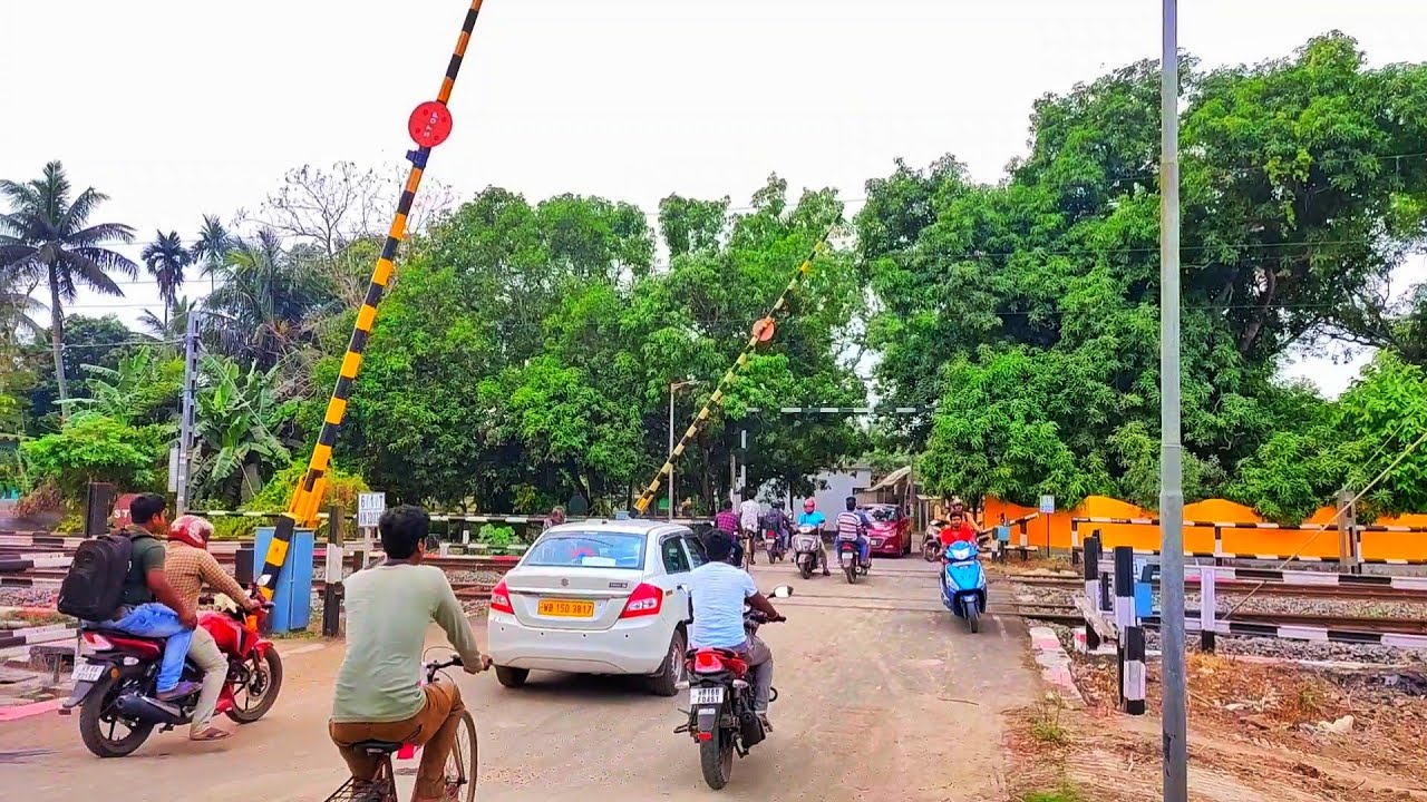 Traffic jam railgate video | Local Train Crossing same time - YouTube