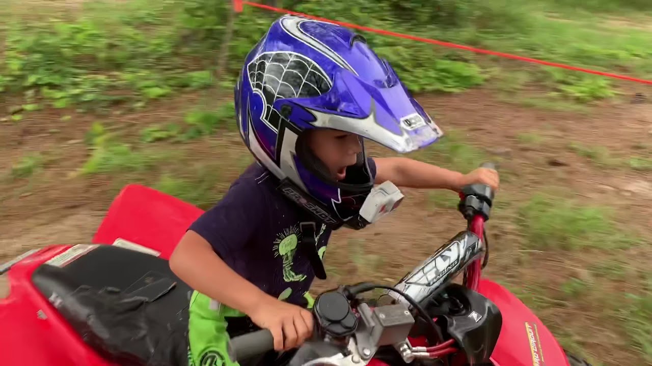 Trx90 3 year old first time on an Mx track by himself - YouTube