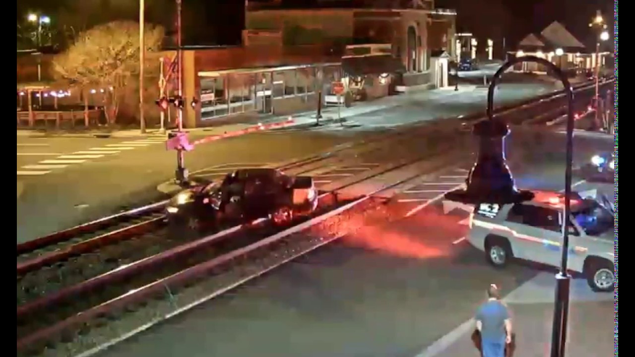 Train Pushes Car off of Track - YouTube